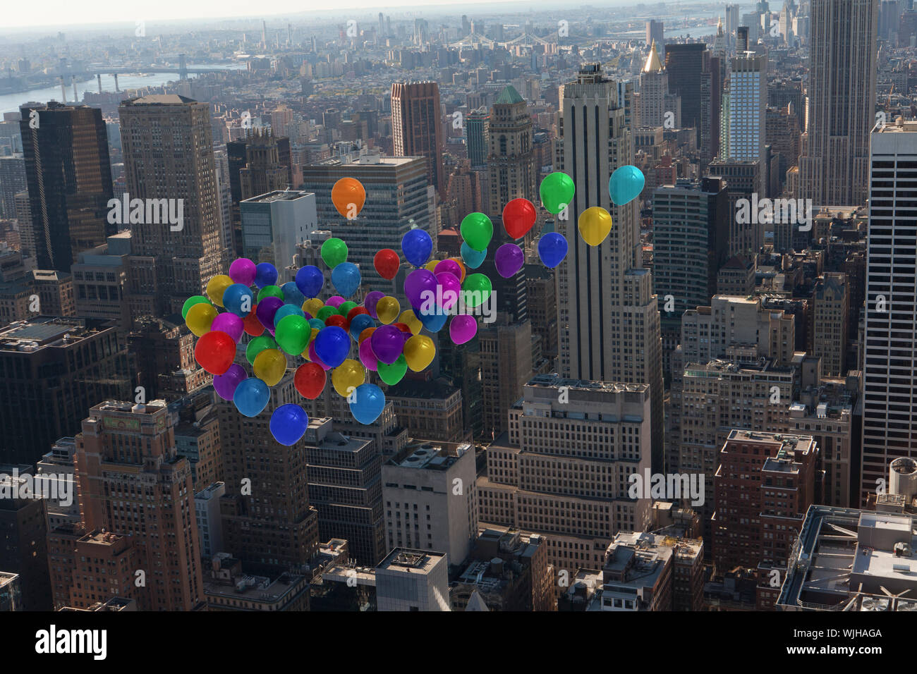 Many colourful balloons above city Stock Photo - Alamy