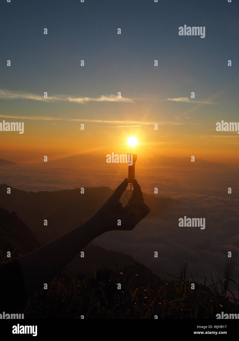 Person shining light at sky hi-res stock photography and images - Alamy