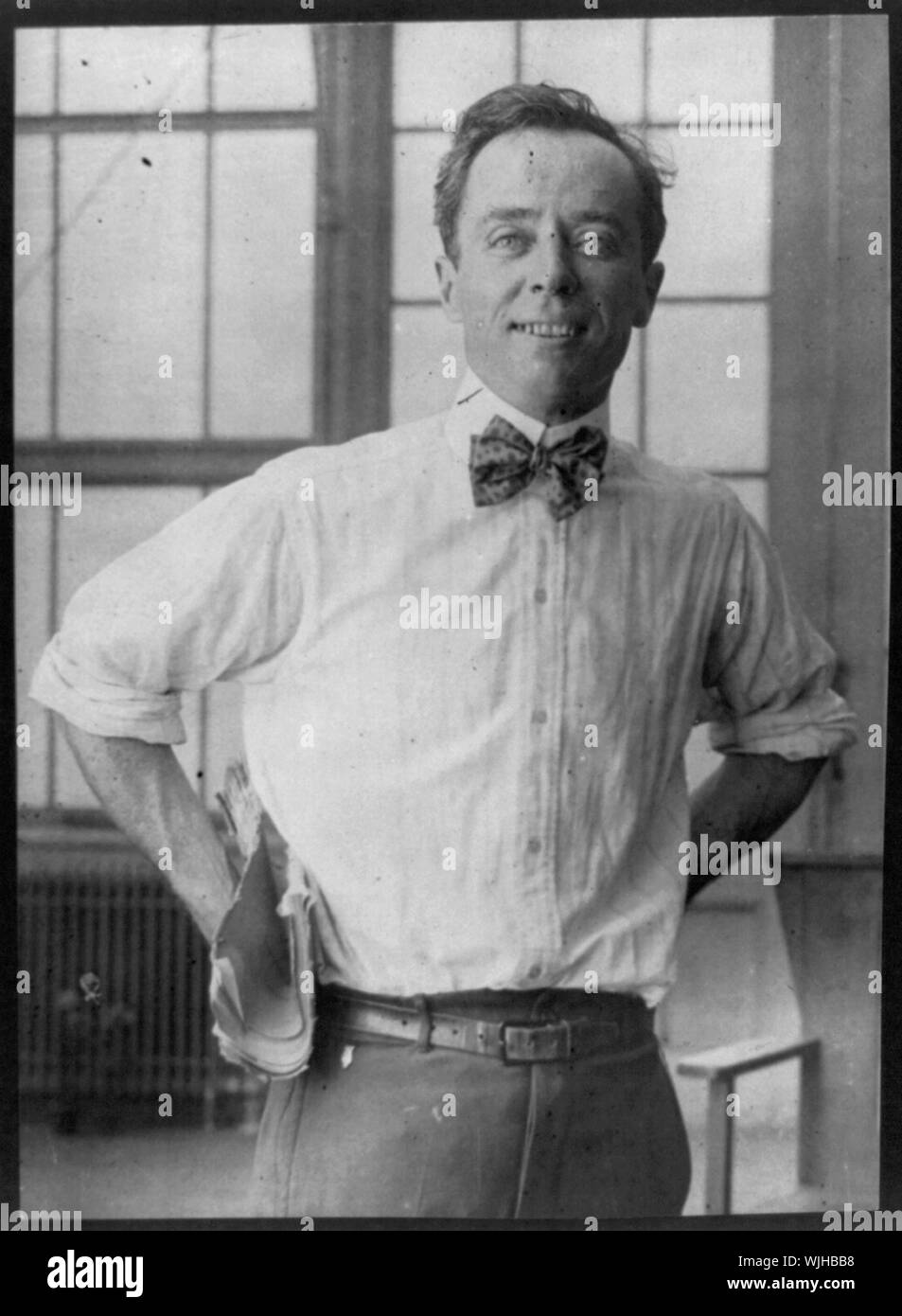 Herbert Brenon, half-length, standing, hands on hips, facing front ...