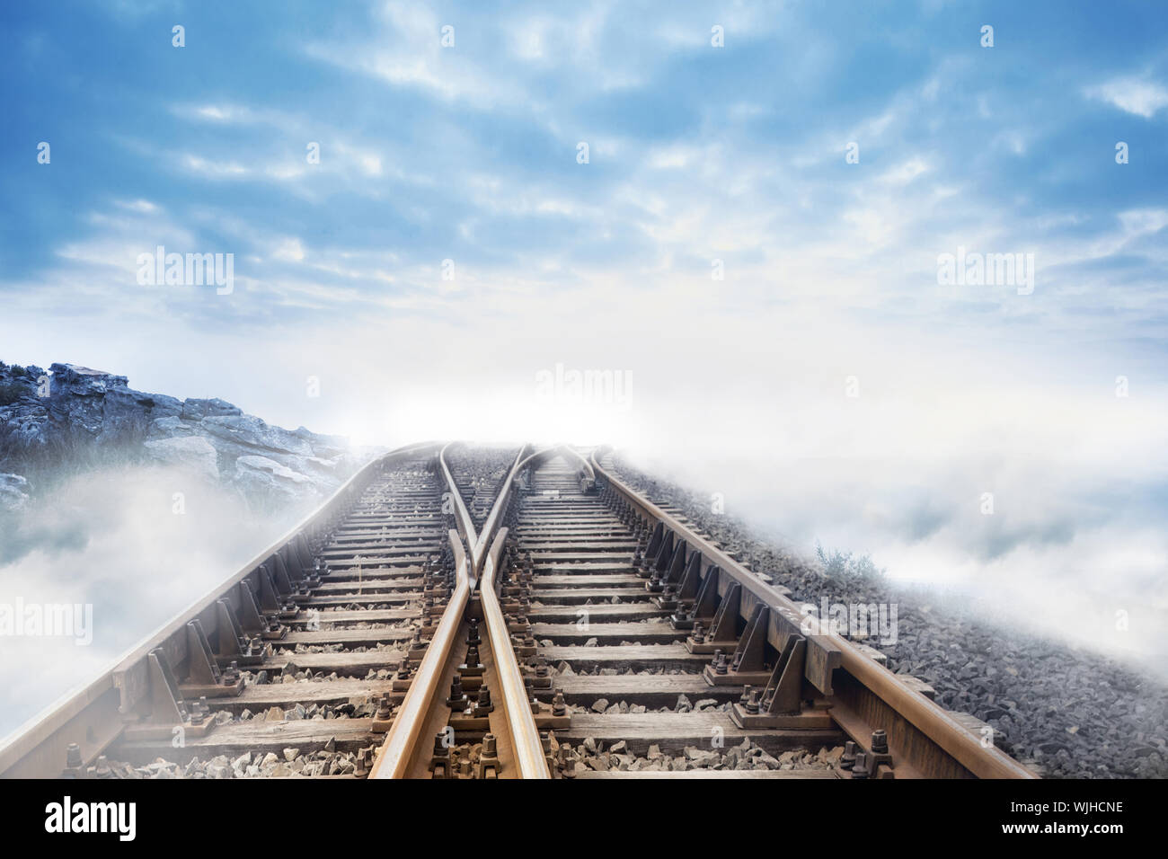 Railway tracks leading to clouds Stock Photo - Alamy