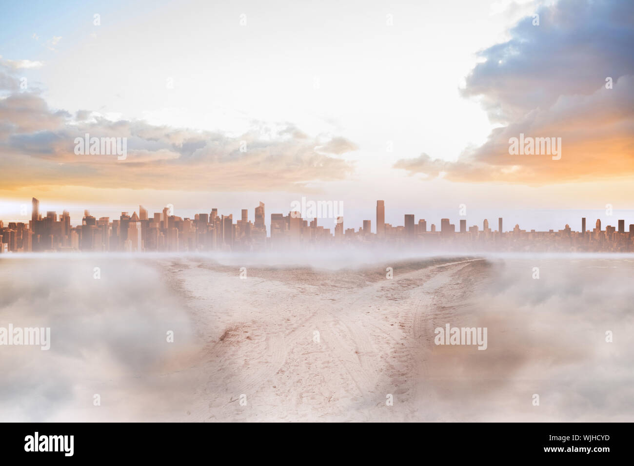 Dusty path in desert leading to city Stock Photo - Alamy