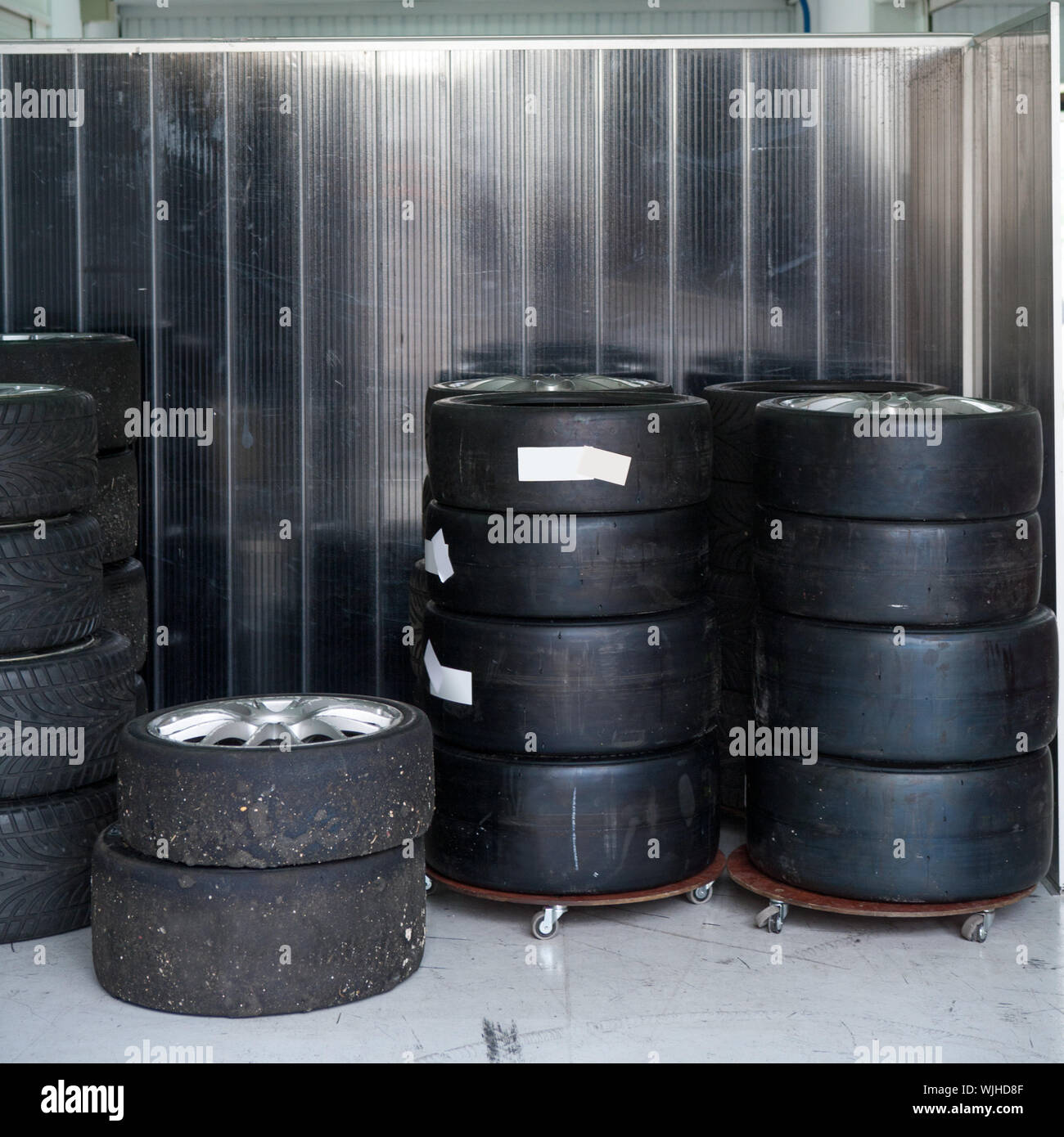 Formula One 1 race tires and wheels in boxes Stock Photo - Alamy