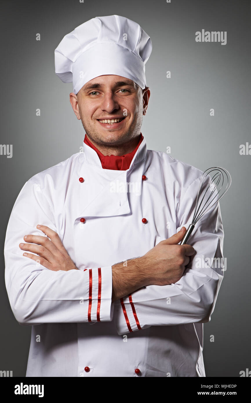 Male chef portrait against grey background Stock Photo - Alamy