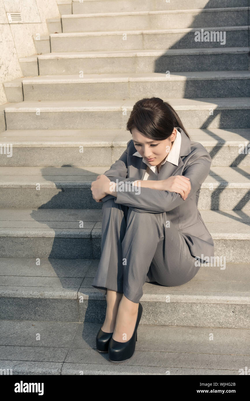 Woman cry stairs hi-res stock photography and images - Alamy