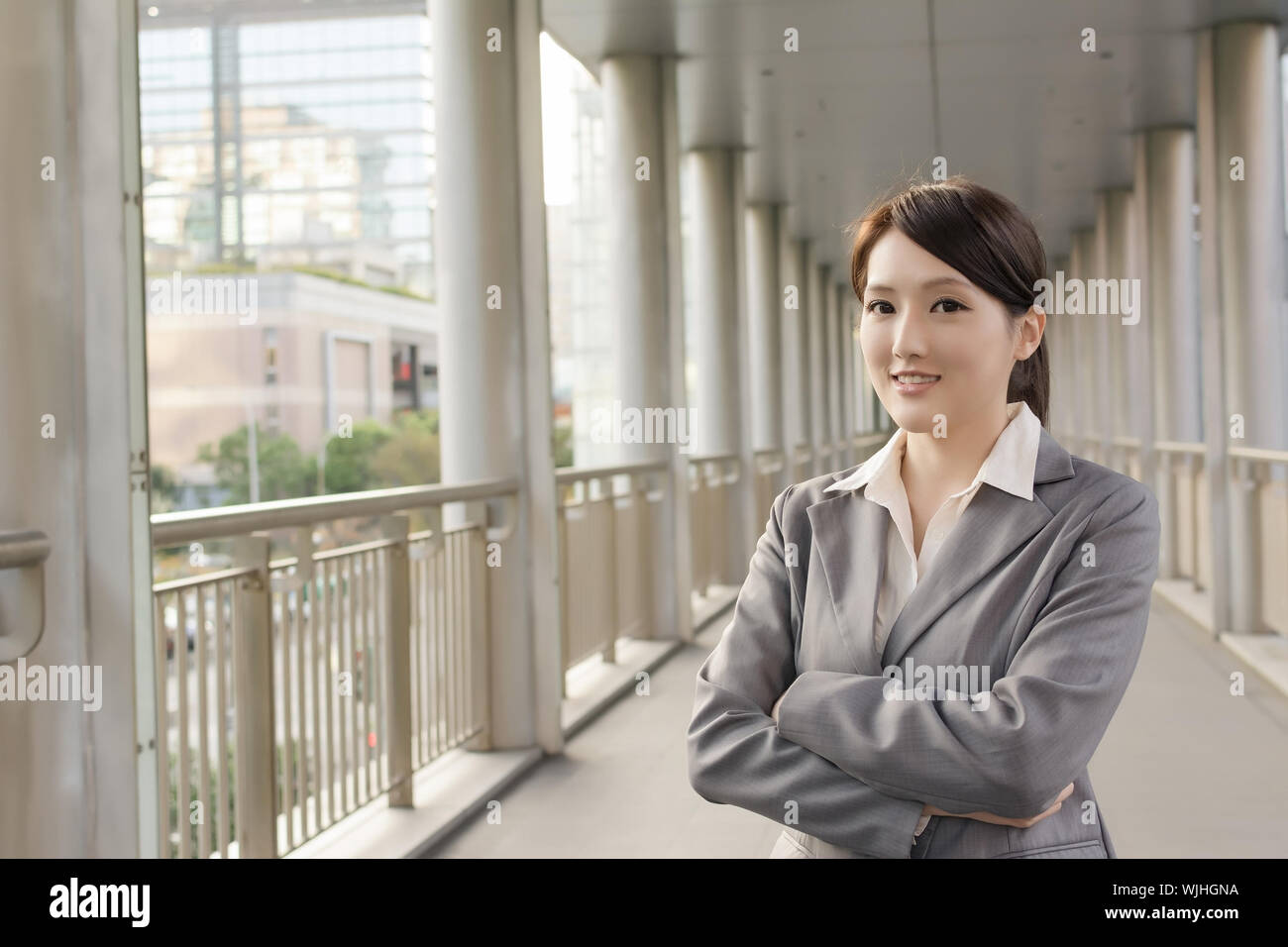 Friendly business woman of Asian with copyspace in modern city Stock ...