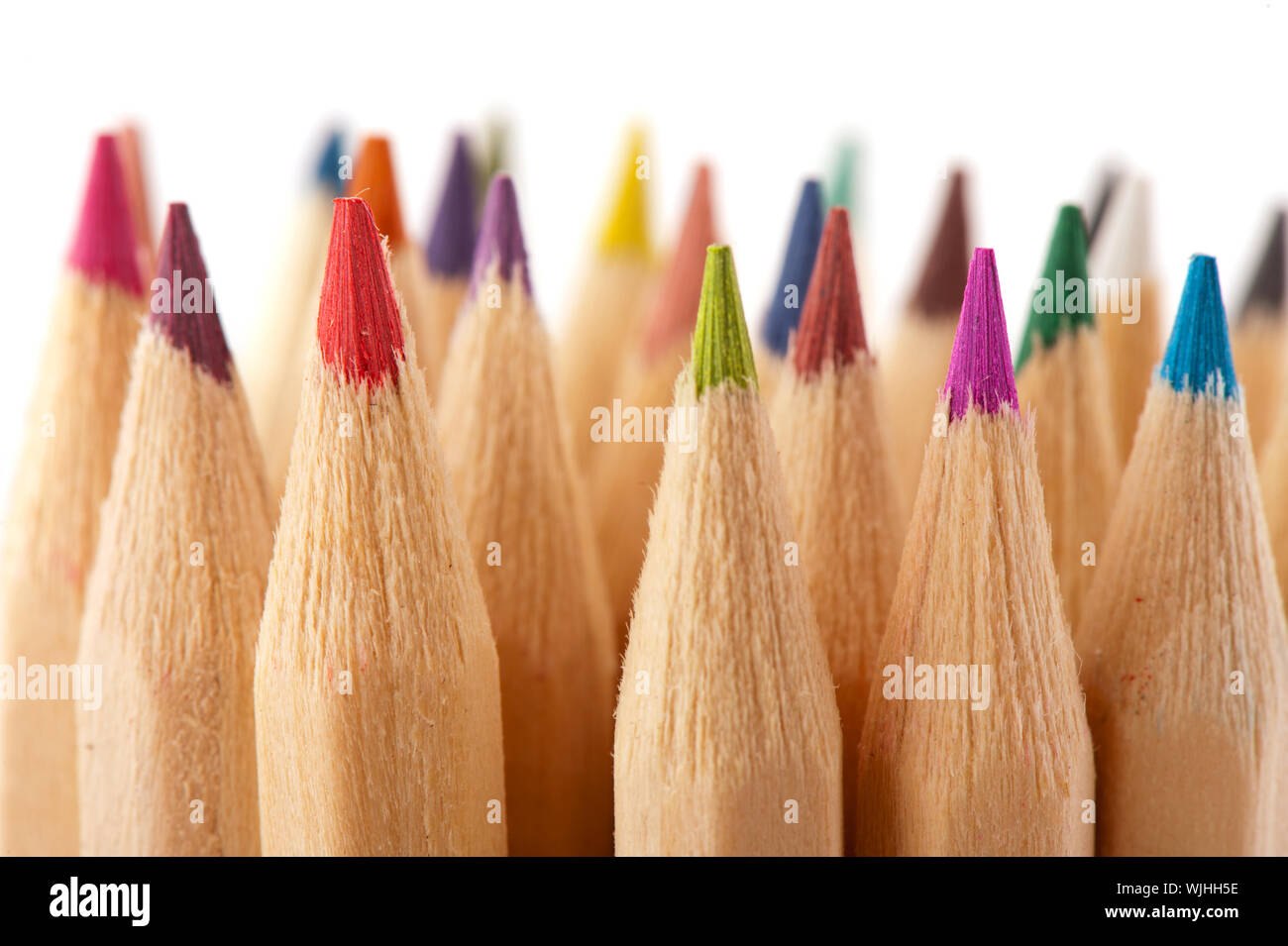 Many wooden color pencils isolated over white Stock Photo - Alamy