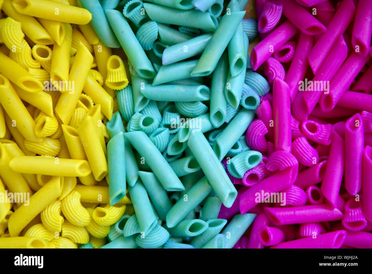 Colorful pasta food in three colors, yellow, blue and pink Stock Photo ...
