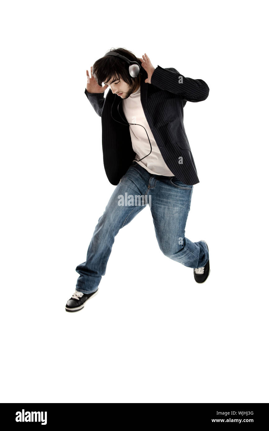Young modern man jumping over a white background Stock Photo - Alamy