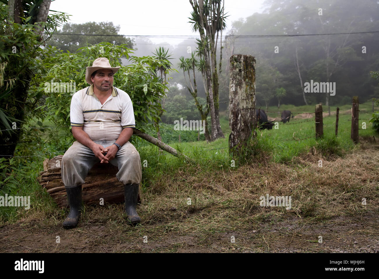 Wide angle shot of Costa Rican ranch hand by the side of the road Stock ...