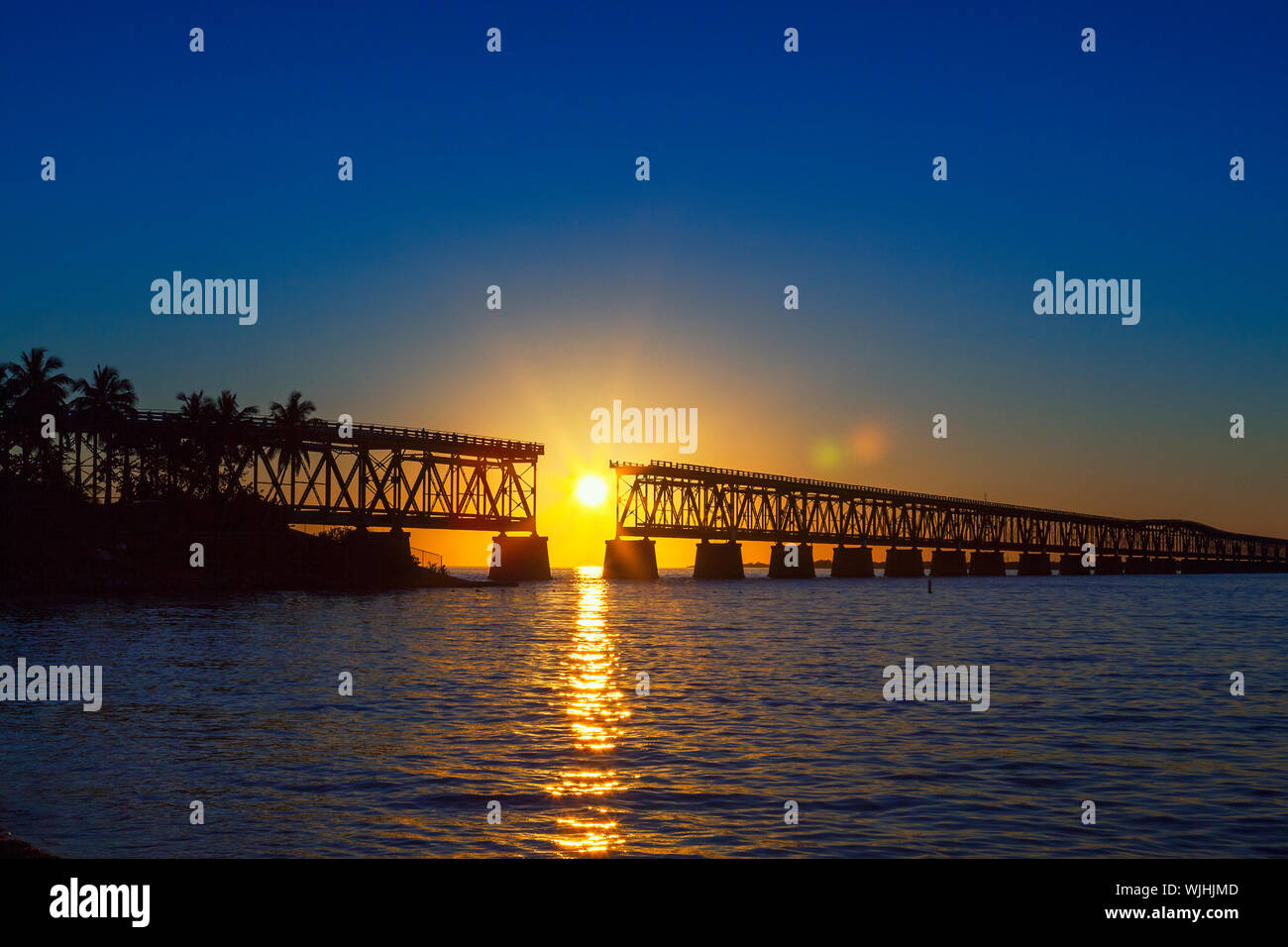 Beautiful colorful sunset or sunrise with broken bridge Stock Photo - Alamy