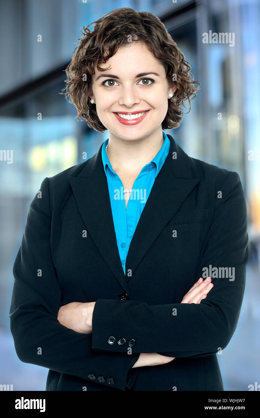 Female executive posing confidently Stock Photo - Alamy