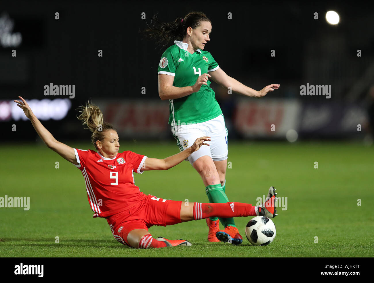 Northern Ireland's Sarah McFadden is tackled by Wales' Kayleigh Green ...