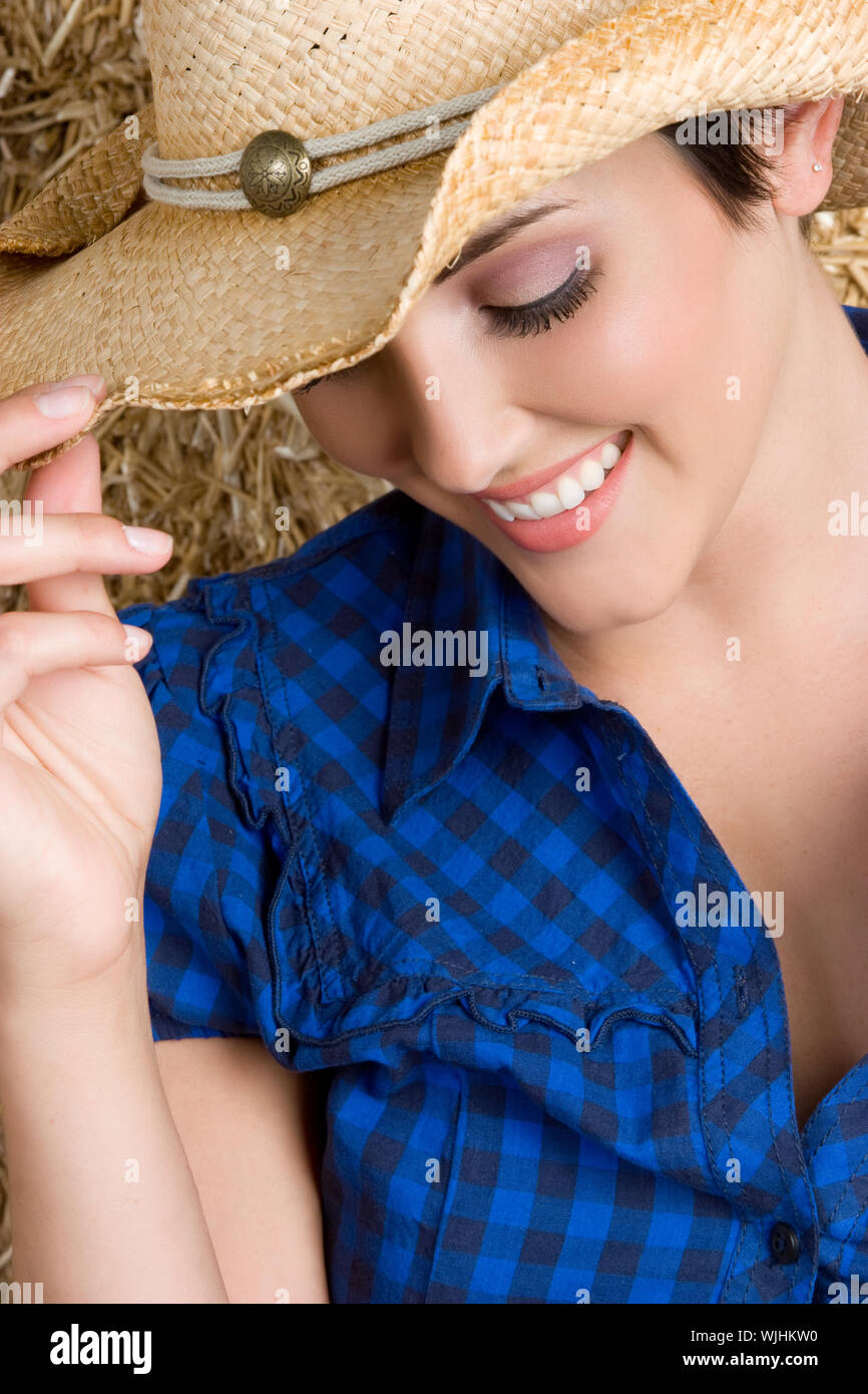 Pretty country girl wearing hat Stock Photo - Alamy
