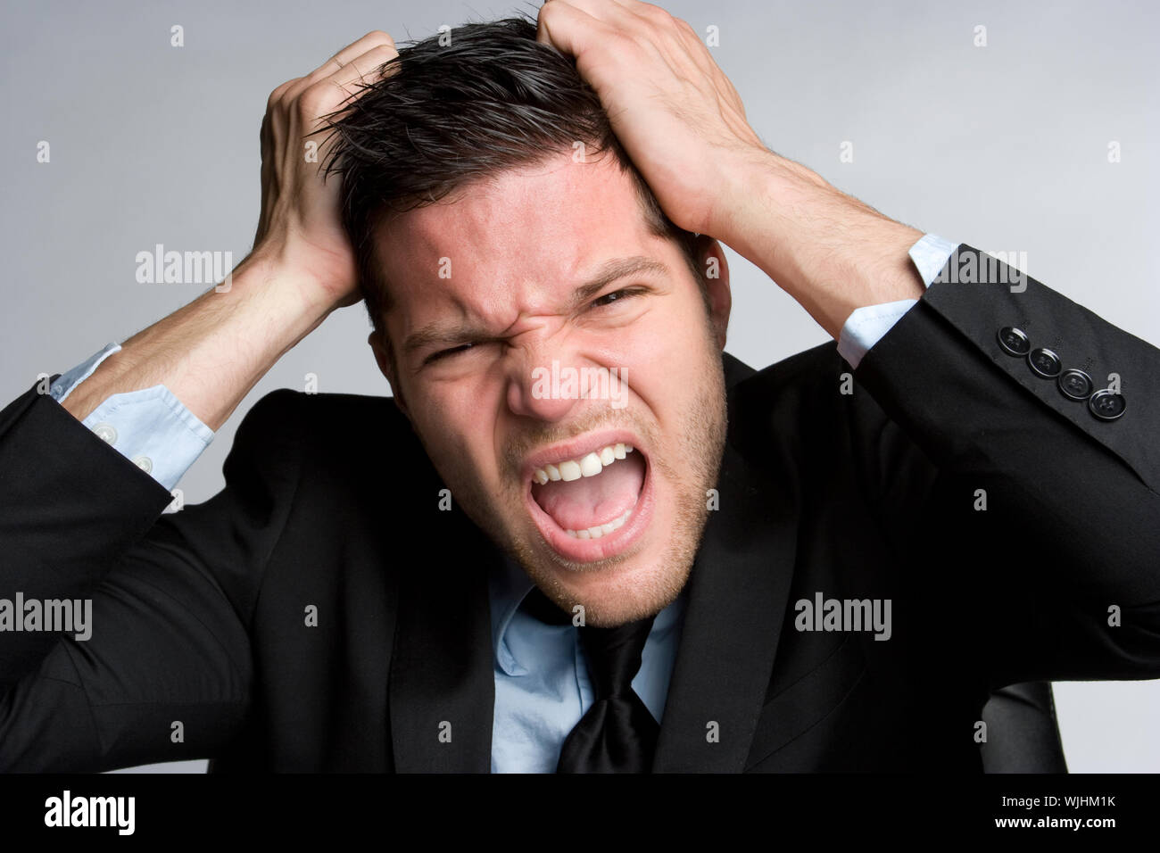 Angry frustrated businessman Stock Photo - Alamy