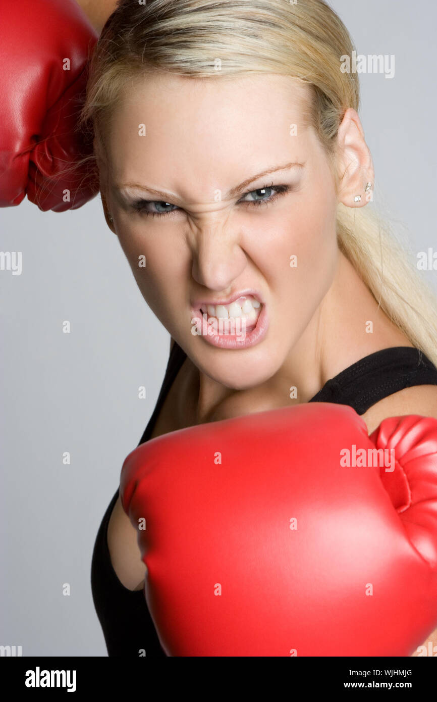 Aggressive blond woman boxing Stock Photo - Alamy