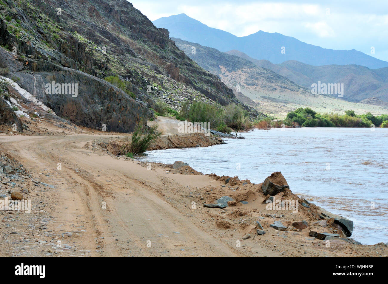 Scenic C13 route in Namibia along a flooded Orange River on the border ...