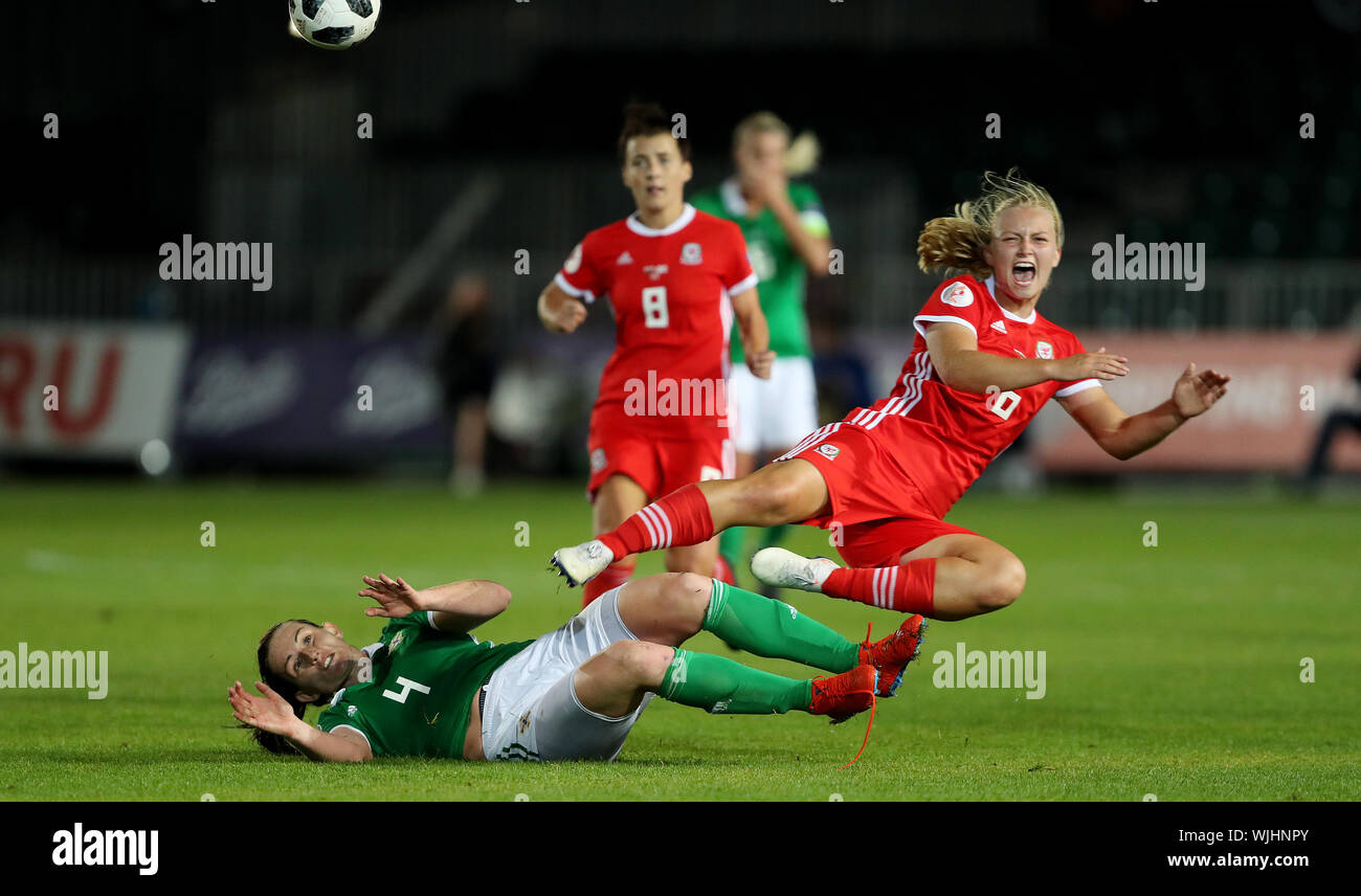 Wales' Elise Hughes is tackled by Northern Ireland's Sarah McFadden ...