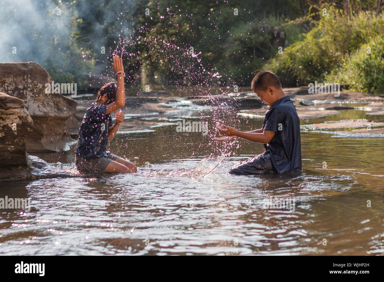 Two boys playing river hi-res stock photography and images - Alamy