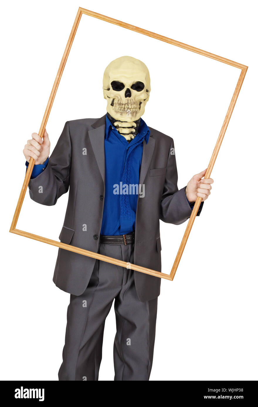 A man dressed as a skeleton in a wooden frame on white background Stock ...