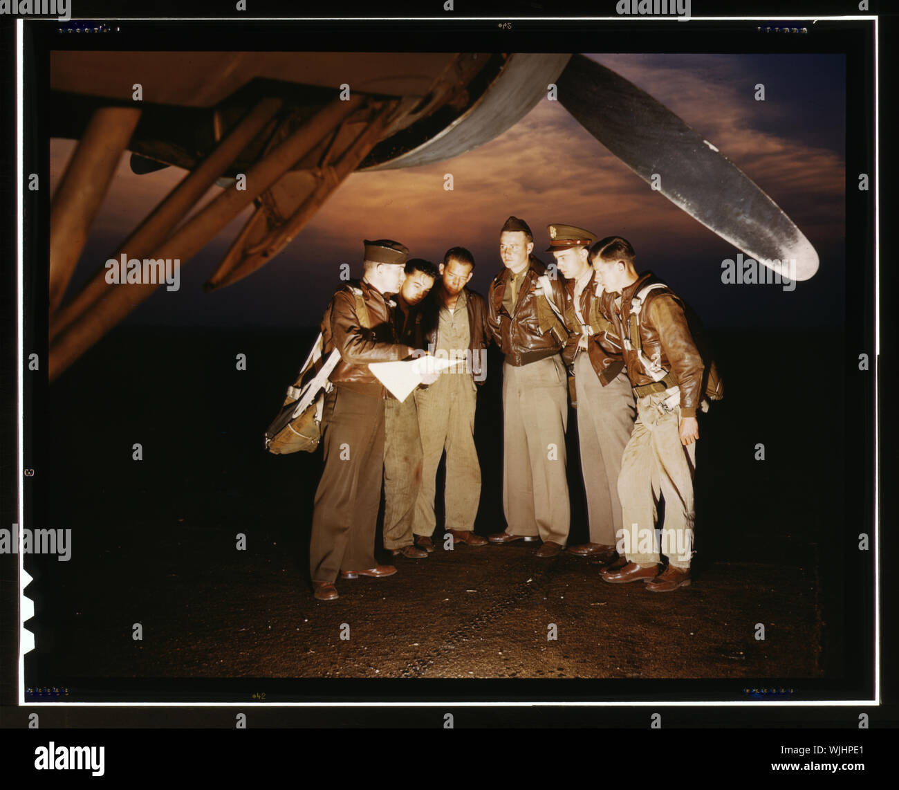 Here's our mission. A combat crew receives final instructions just ...