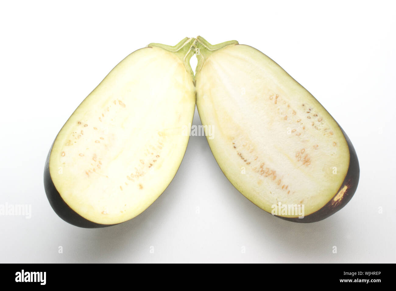 one eggplant cut in to half Stock Photo - Alamy