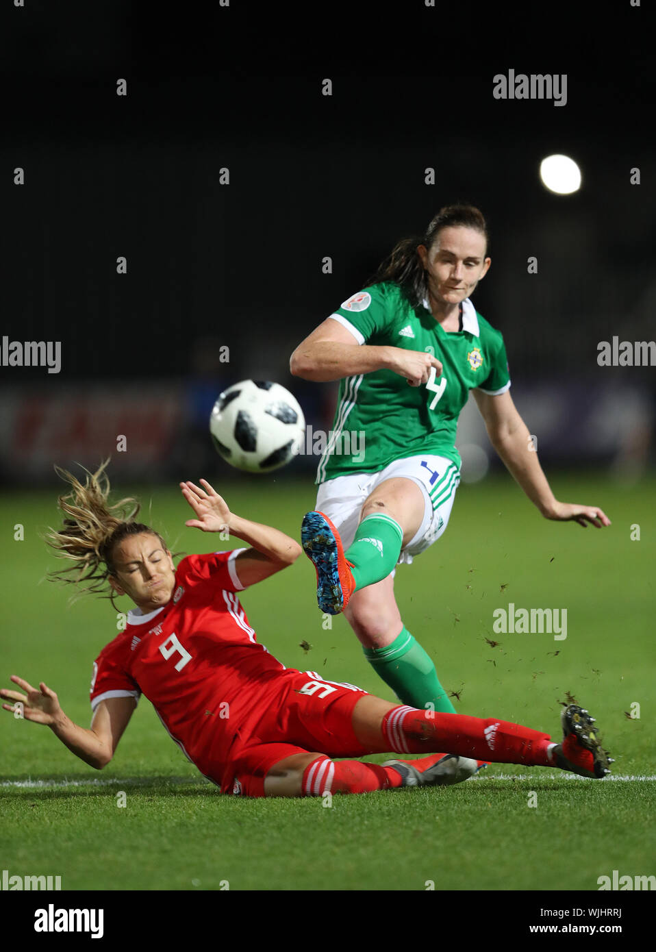 Northern Ireland's Sarah McFadden is tackled by Wales' Kayleigh Green ...