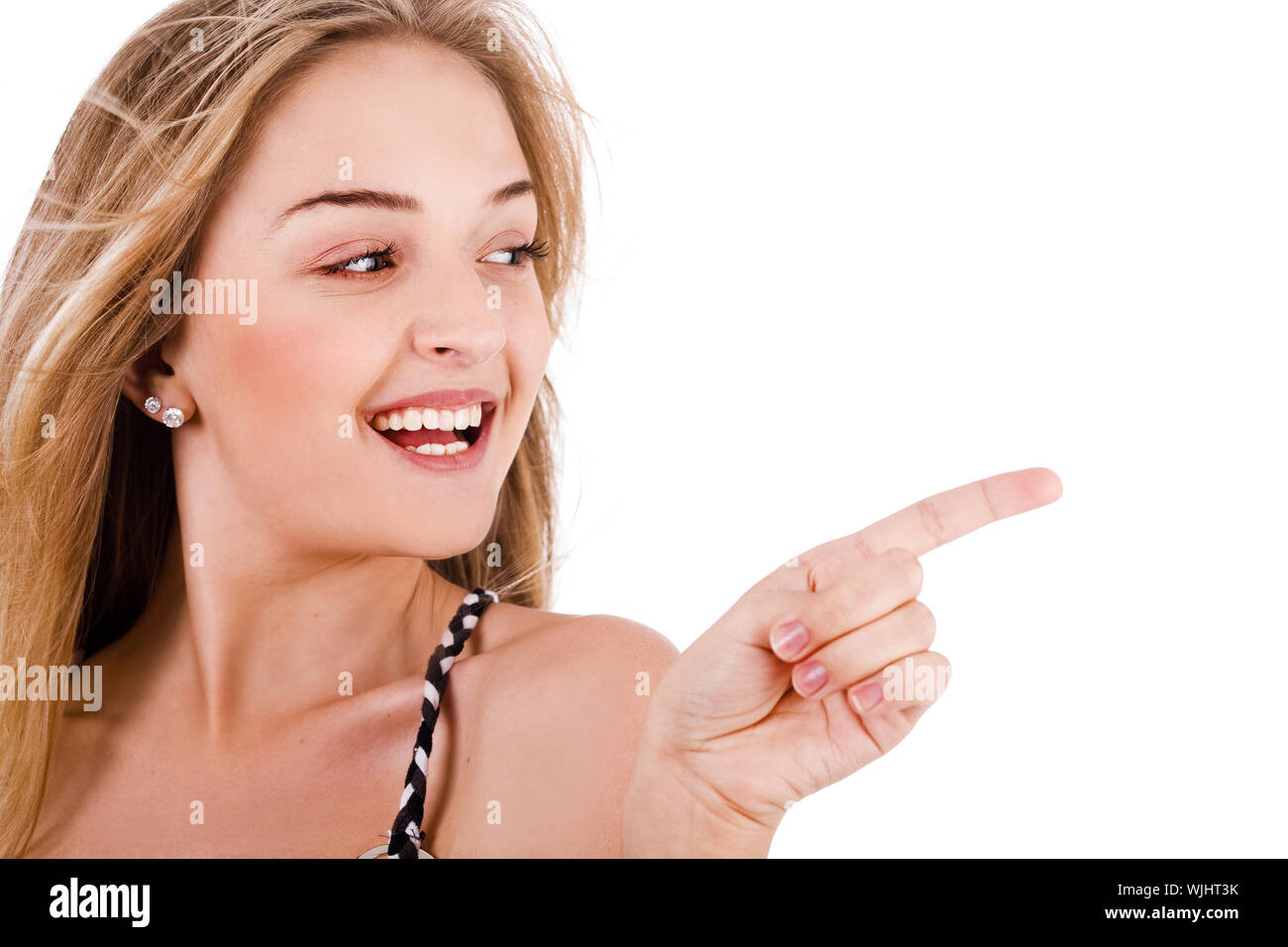 Closeup of young model pointing empty space on a white background Stock ...