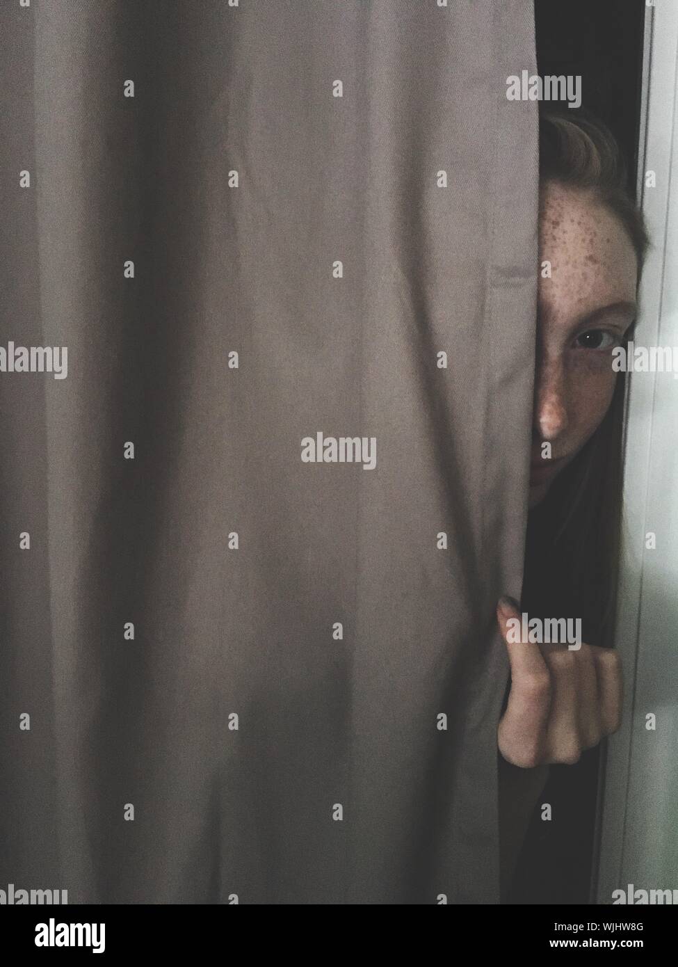 Girl Peeking Through Curtain High Resolution Stock Photography and ...
