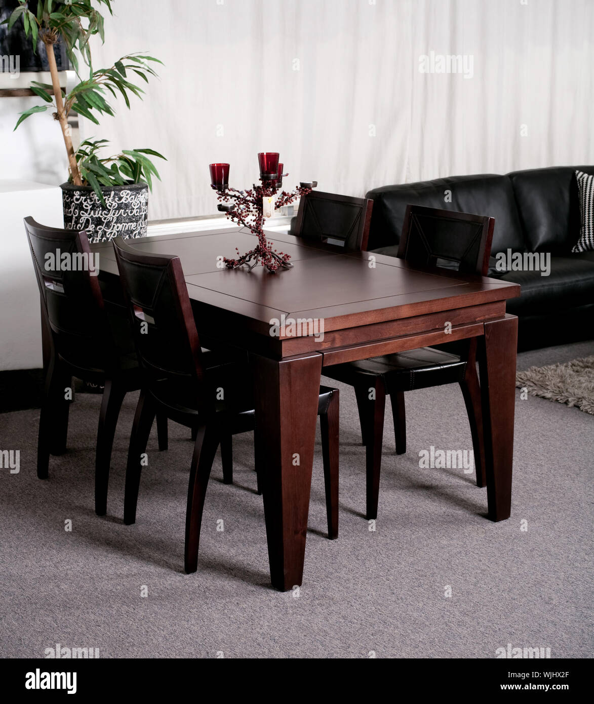 Modern dining table in an stylish furnished modern house Stock Photo ...