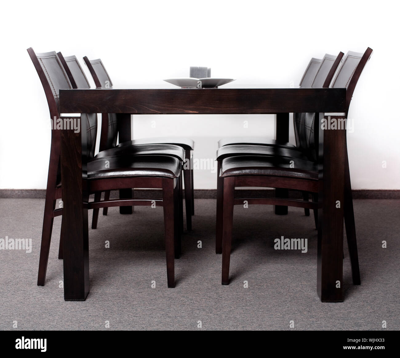 Modern wooden finished dining table with six chair set Stock Photo - Alamy
