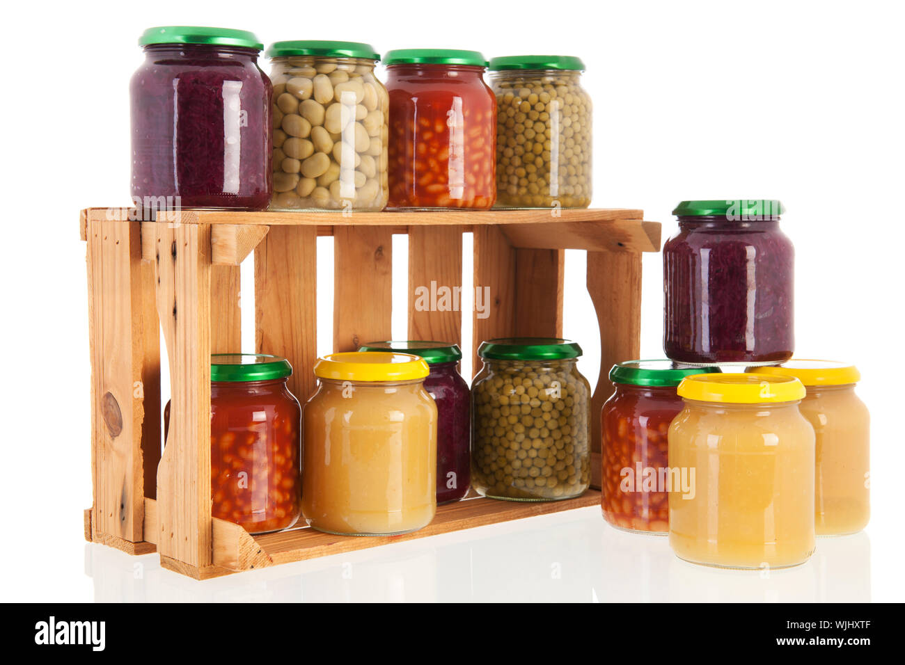 Wooden crate full with glass pots preserved vegetables Stock Photo - Alamy