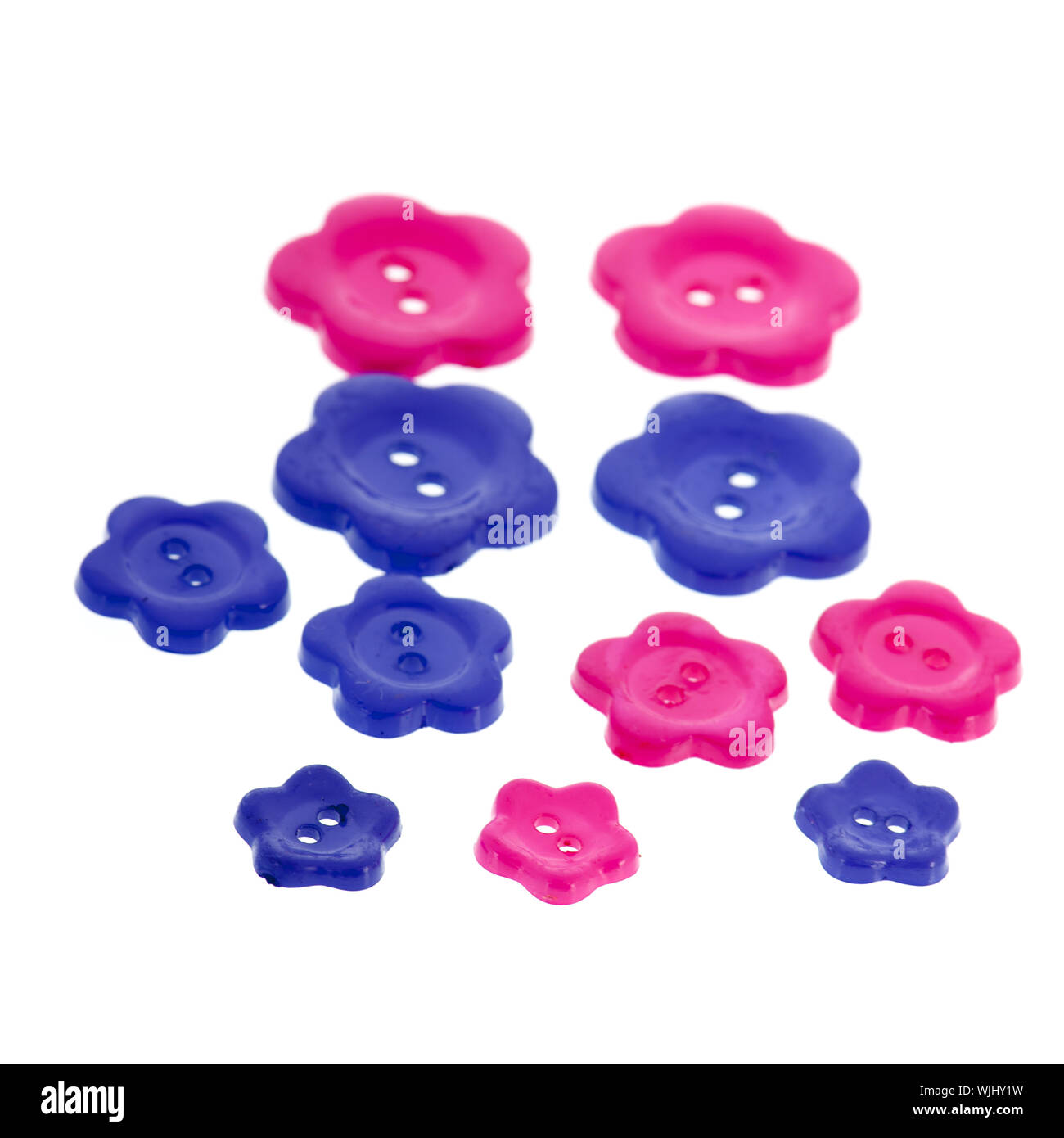 Several colorful buttons in flower shape isolated over white background ...