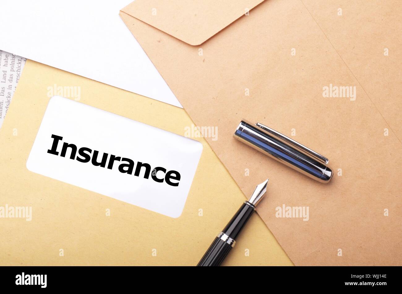 insurance concept with envelope showing risk concept Stock Photo - Alamy