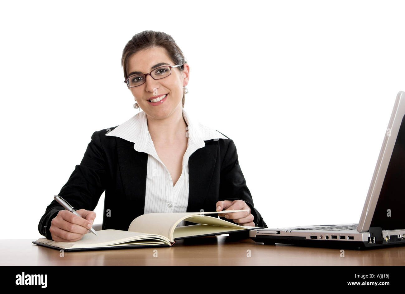 Beautiful business woman at office working - isolated on white ...