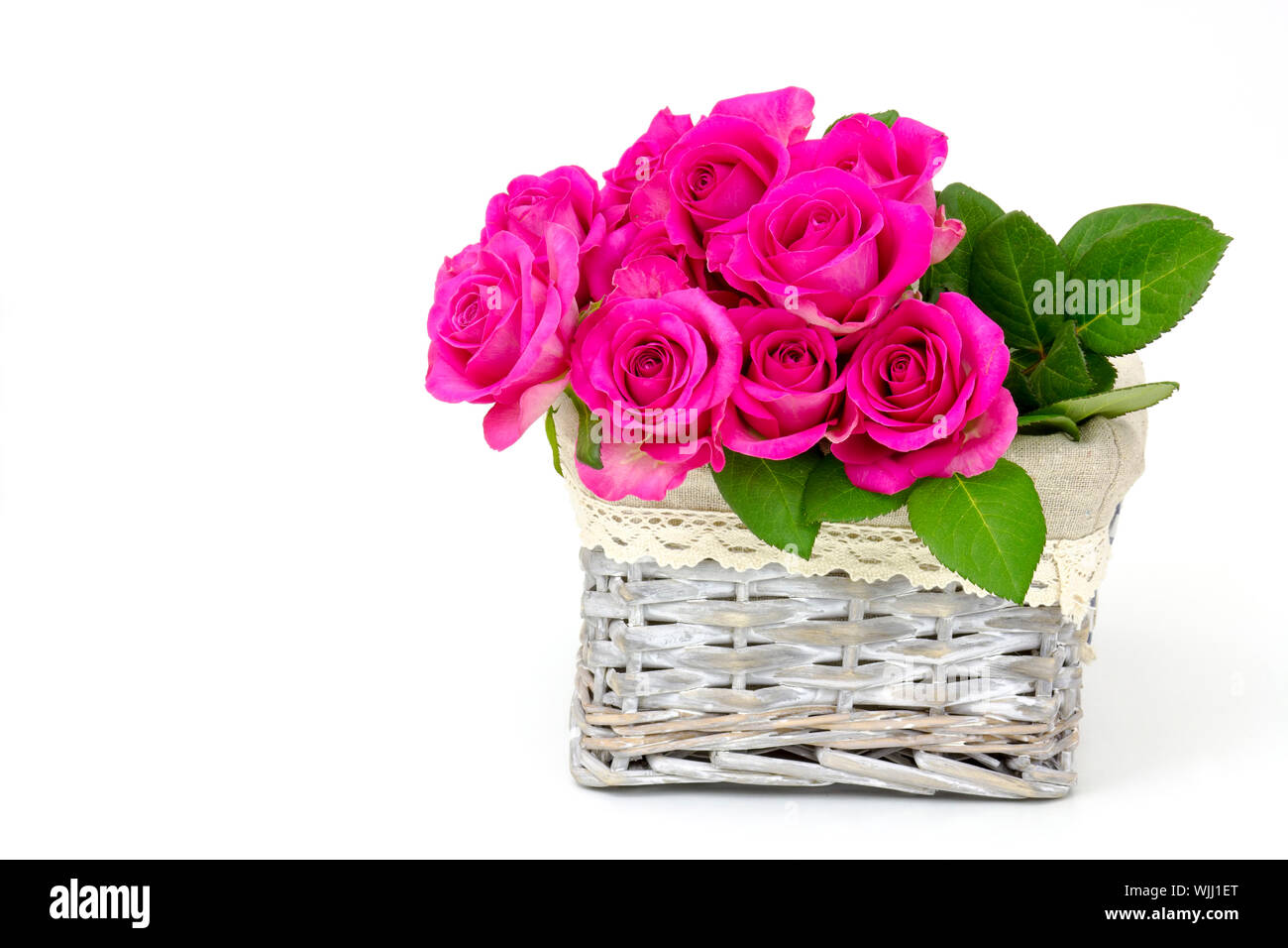 pink roses in a basket Stock Photo - Alamy