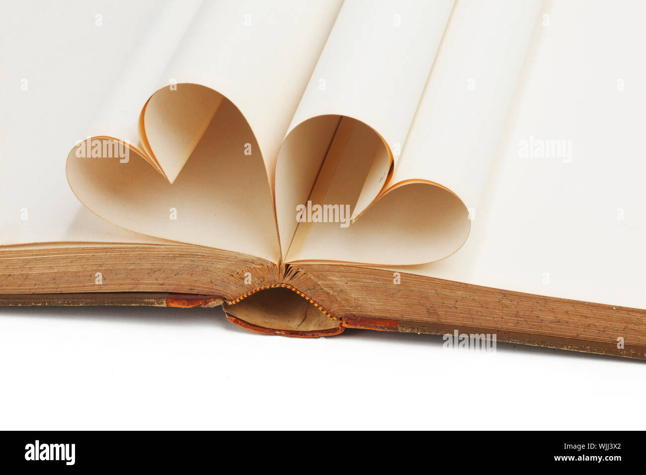 Heart made of blank pages inside a book on white background Stock Photo ...