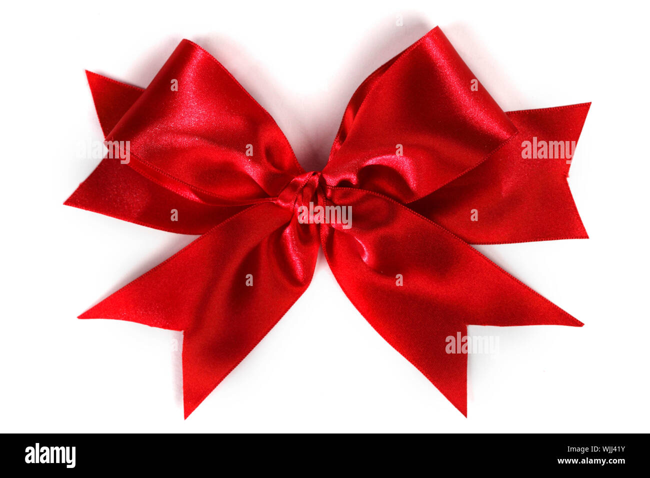 Shiny red satin bow isolated on white background Stock Photo - Alamy