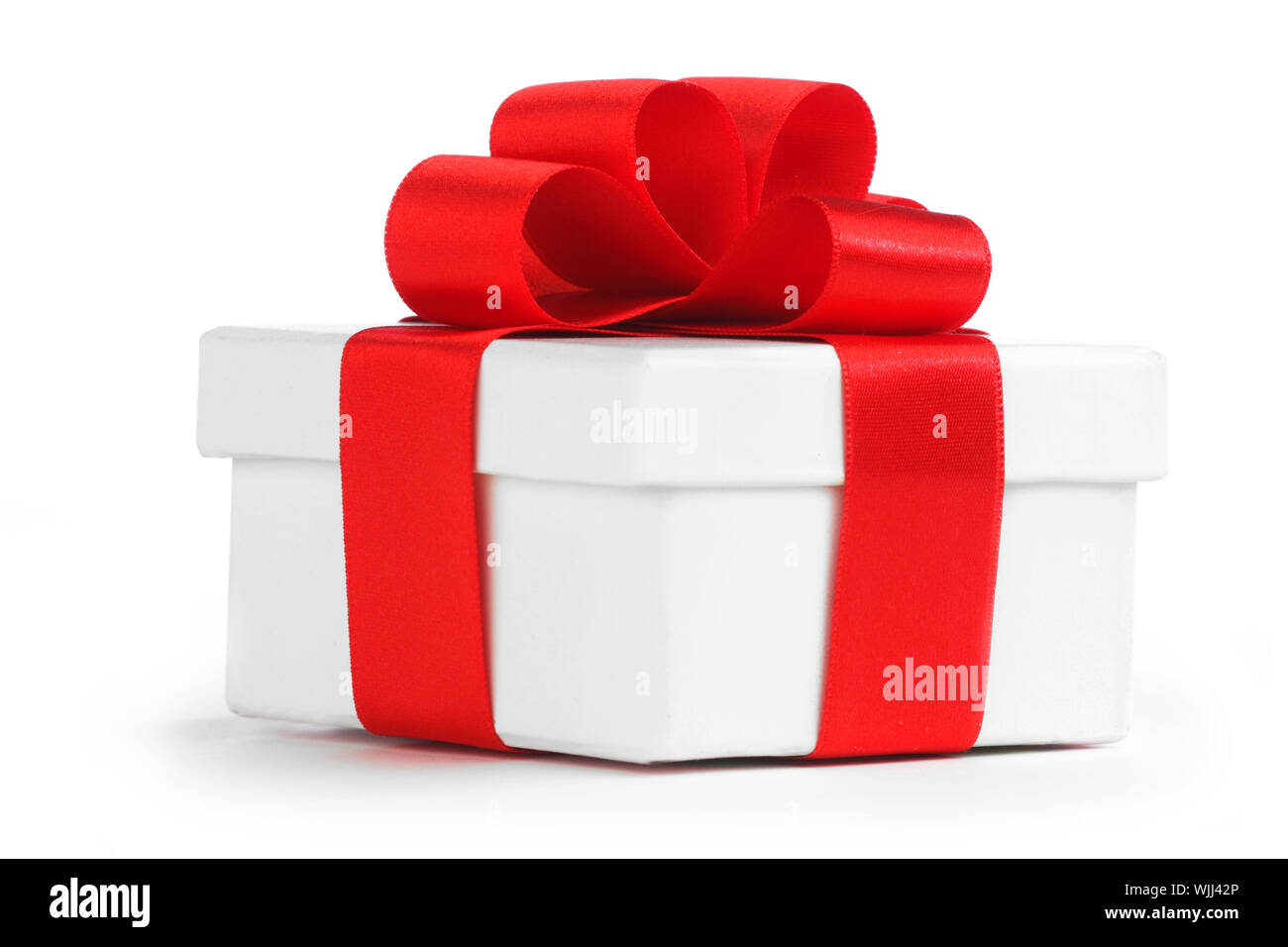 Gift box with red bow isolated on white background Stock Photo - Alamy