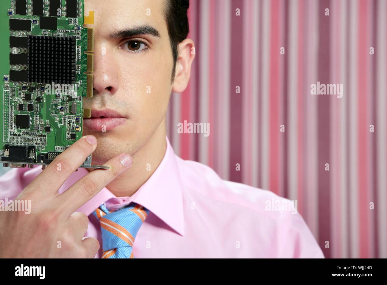Businessman with electronic circuit in face as technology metaphor ...