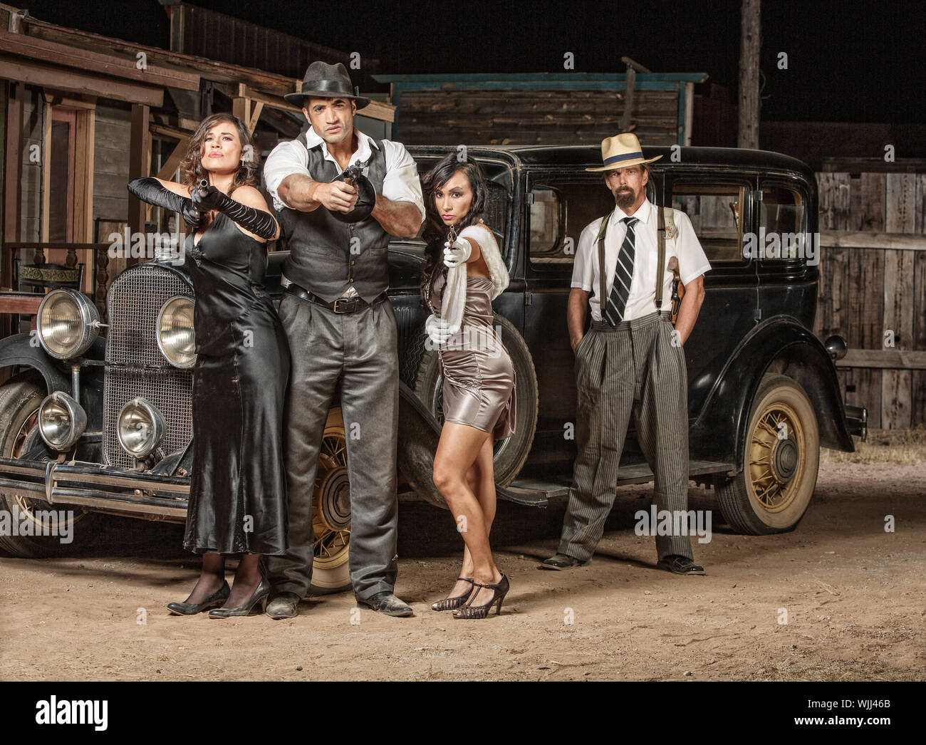 Dangerous 1920s vintage gangsters outside with weapons Stock Photo - Alamy