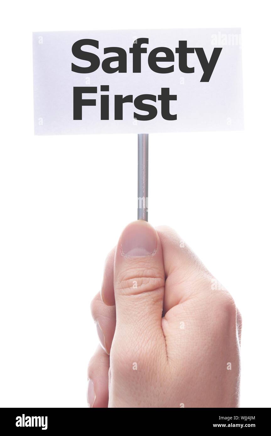 safety first concept with hand word and paper Stock Photo - Alamy
