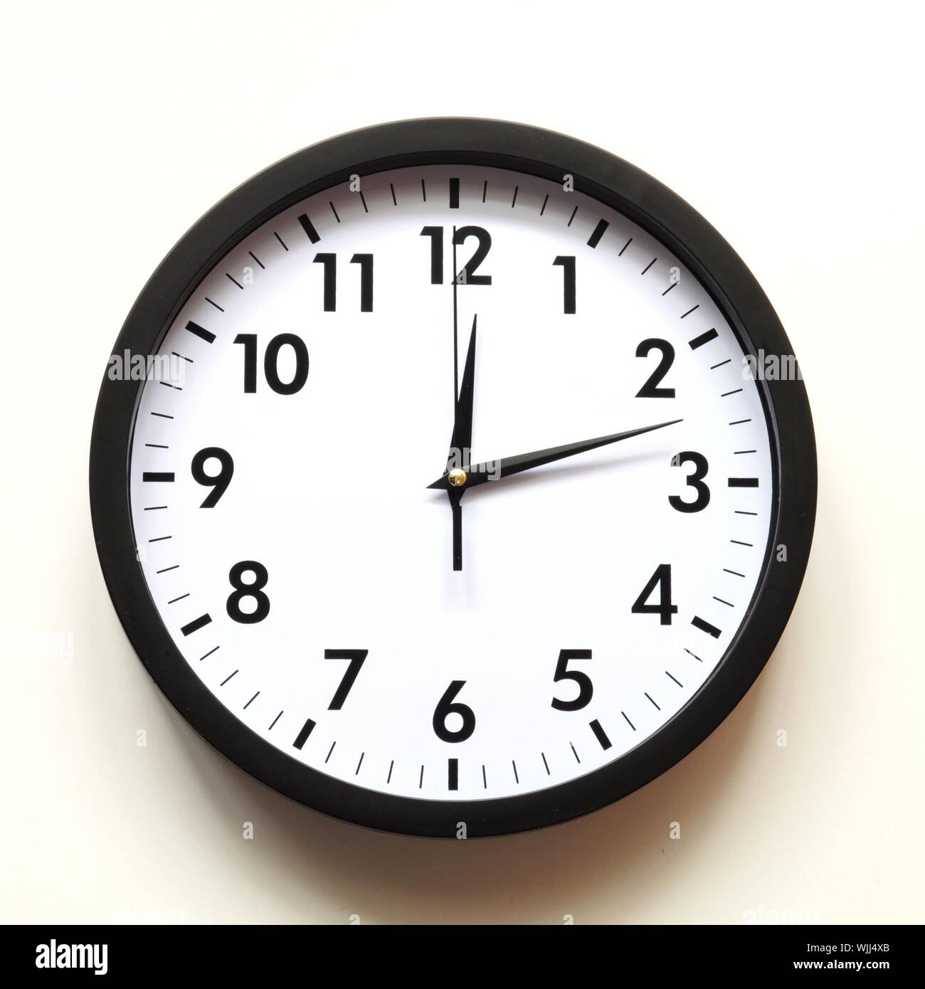 time concept with watch or clock on white wall Stock Photo - Alamy