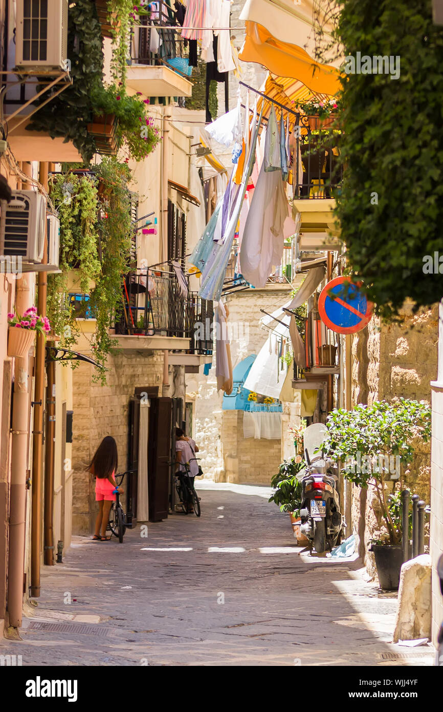 BARI, ITALY - JULY 11, 2018, View of a narrow street in Bari, Puglia ...