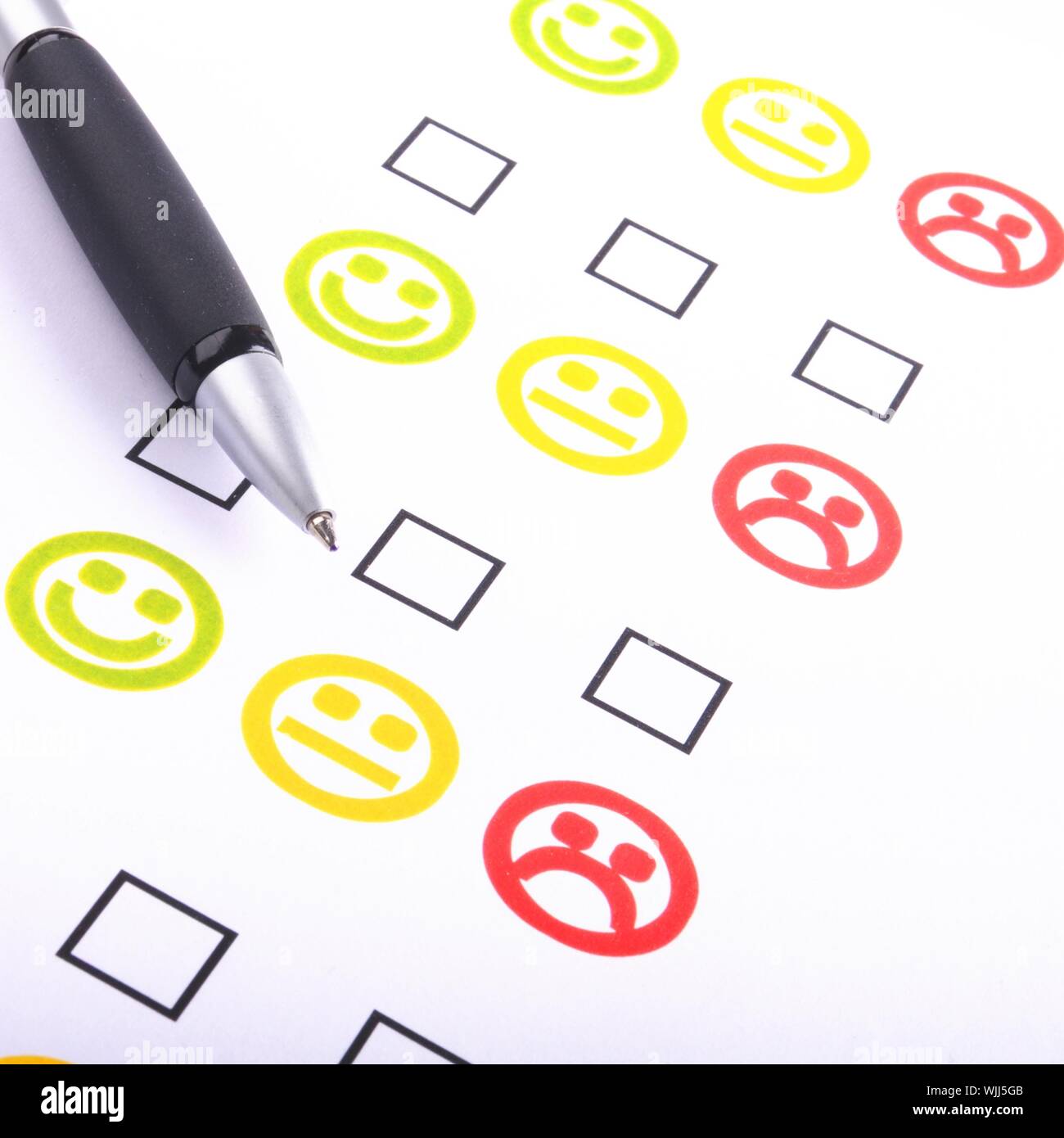 hand pen and checkbox or tickbox with smilie Stock Photo - Alamy