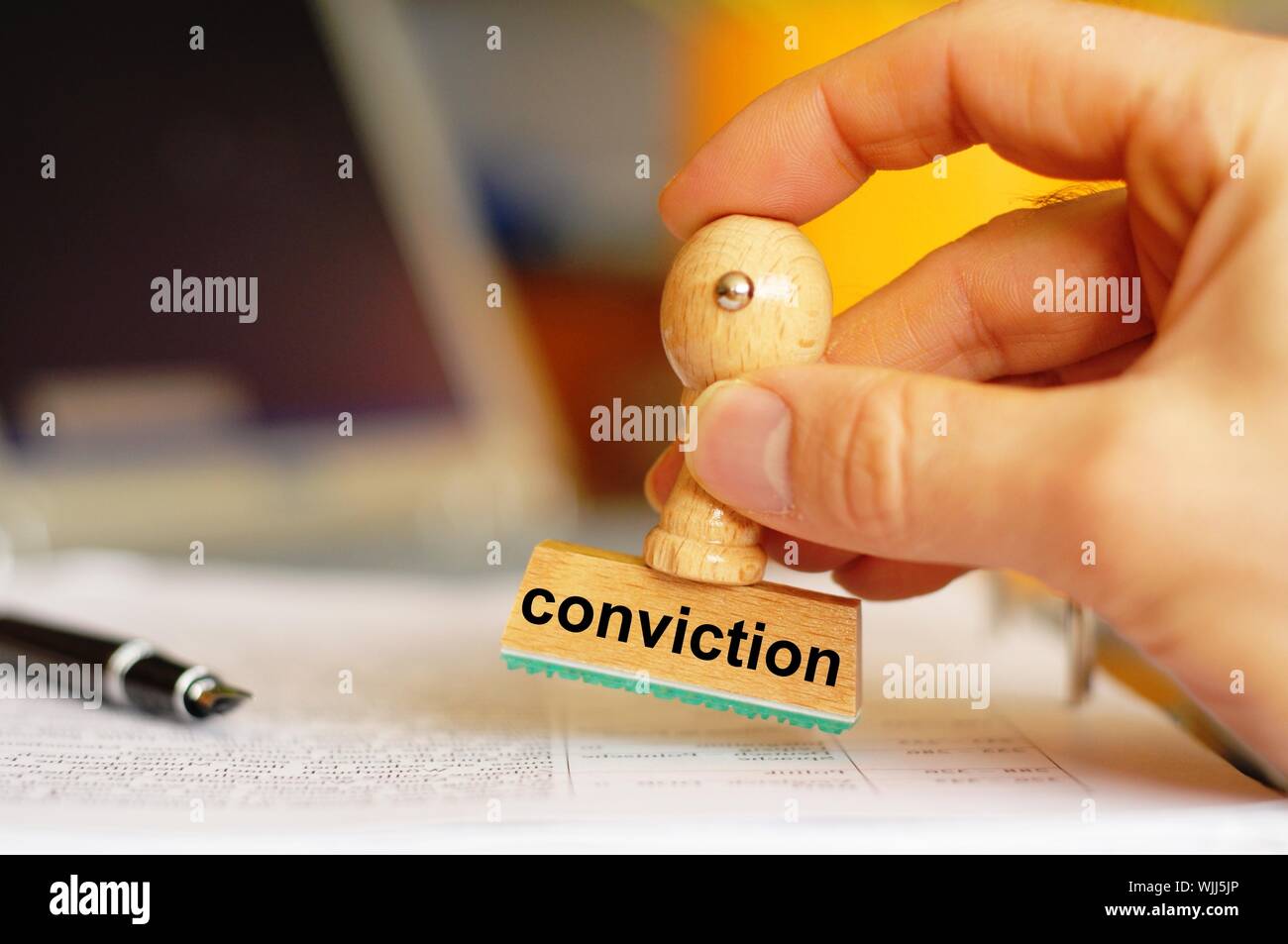 conviction on stamp in office showing law or crime concept with ...