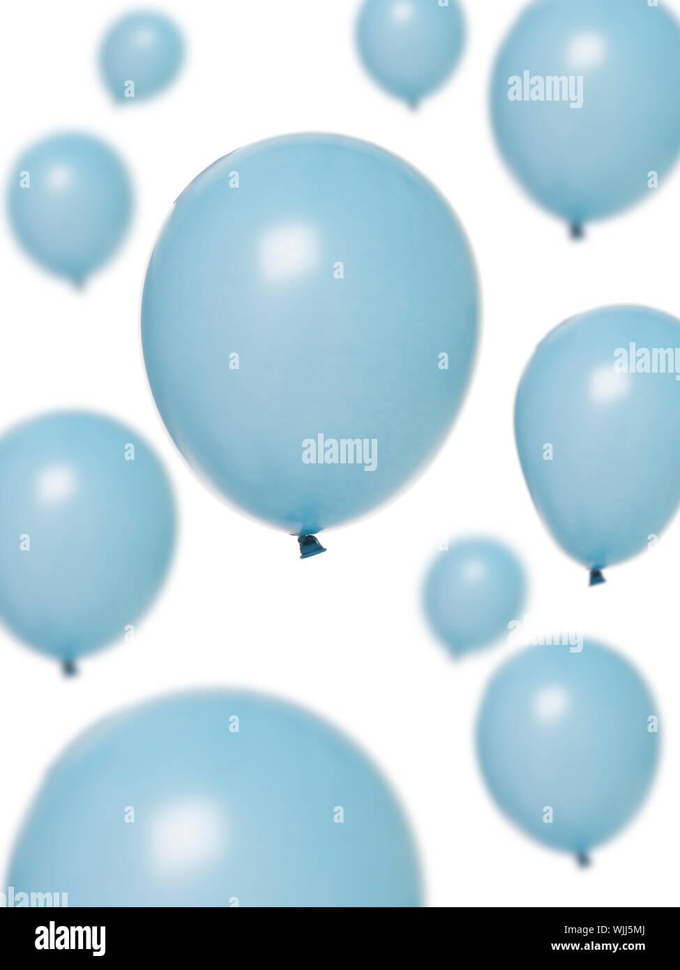 Light blue balloons isolated on white background Stock Photo - Alamy