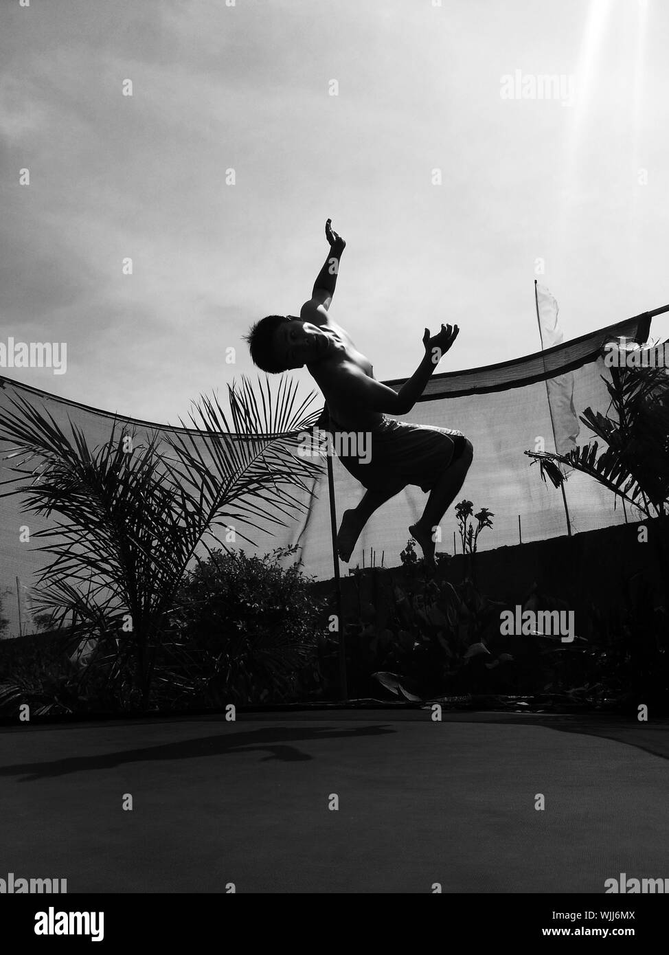 Young man jumping in mid air hi-res stock photography and images - Alamy