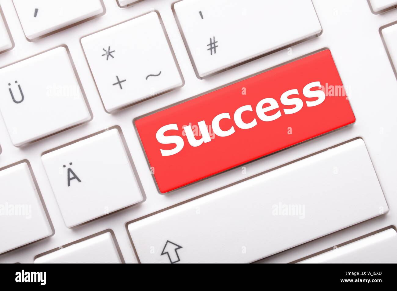 success in business concept with key on computer keyboard Stock Photo ...
