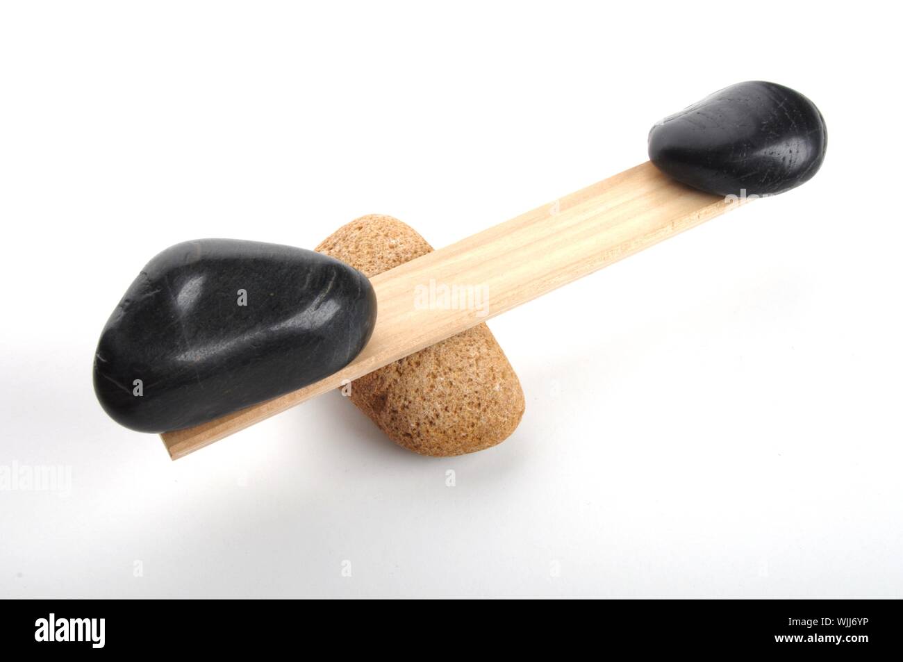 scales with zen stone isolated on white showing balance or spa Stock ...