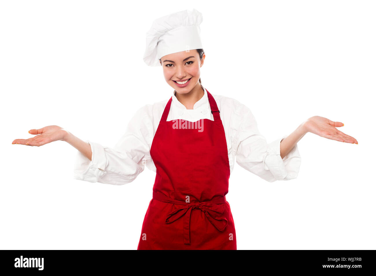 Female chef standing with open palms, warm welcome gesture Stock Photo ...